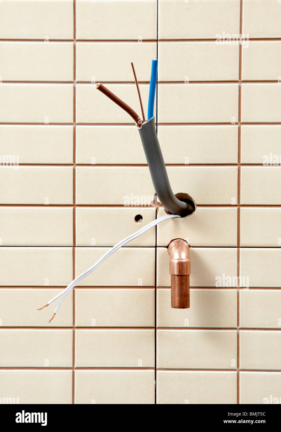 Wiring and plumbing ready for installation of a new shower unit in a ...