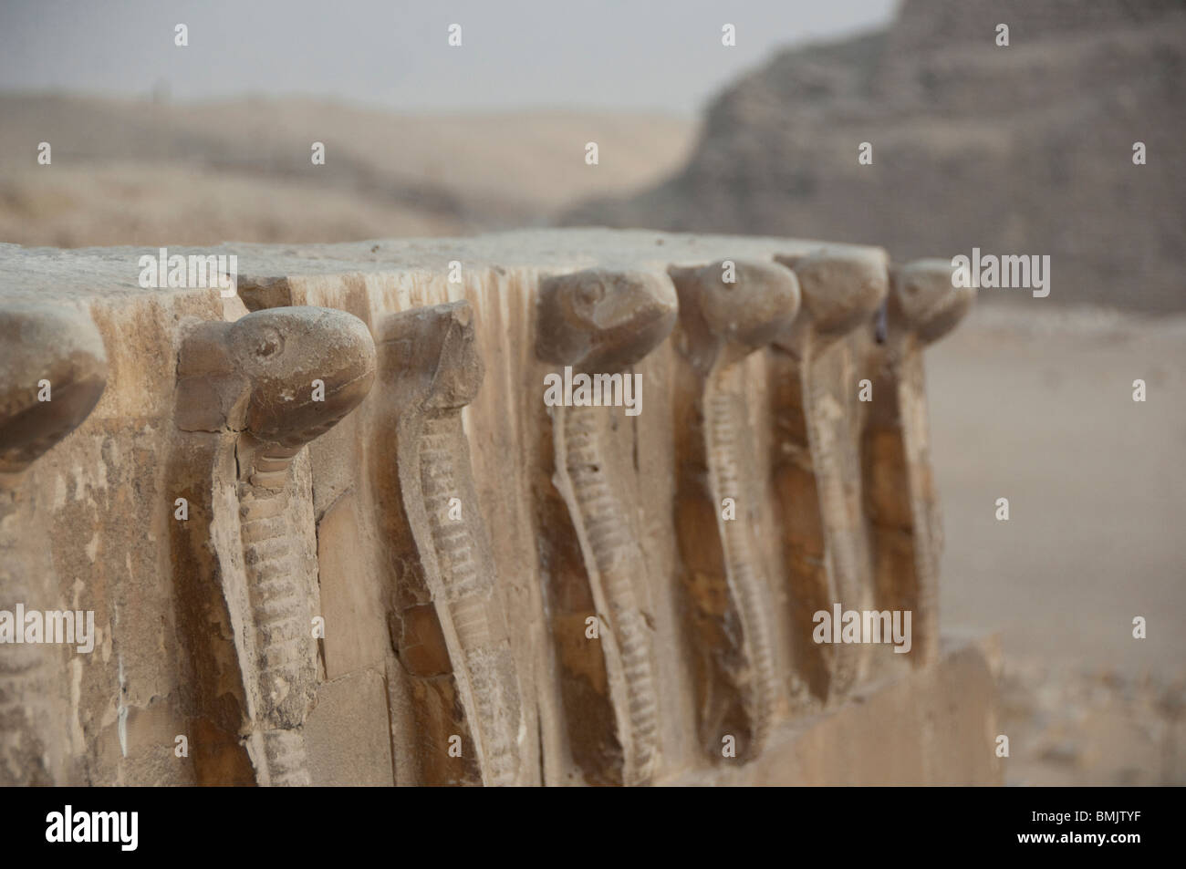 Egypt, Saqqara. Facade of the Cobra Palace with Zoser pyramid in the ...