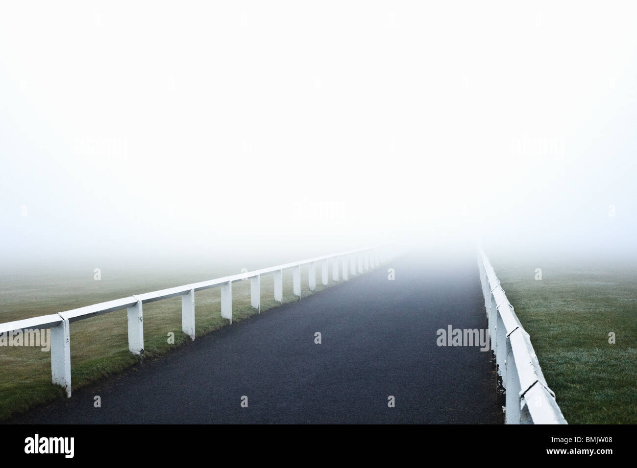 Road leading into fog Stock Photo - Alamy