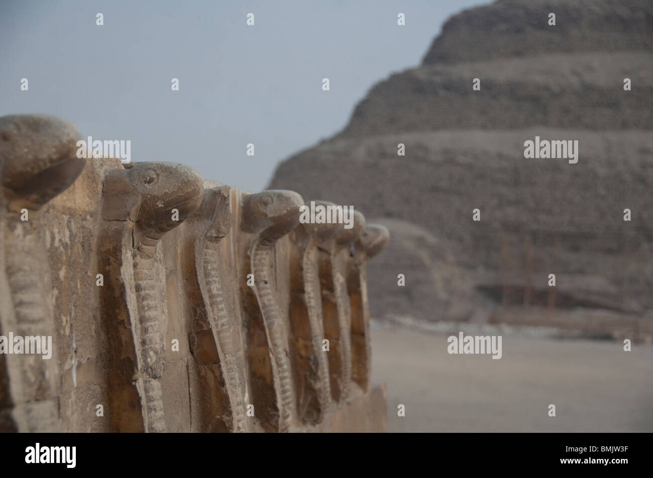 Egypt, Saqqara. Facade of the Cobra Palace with Zoser pyramid in the ...