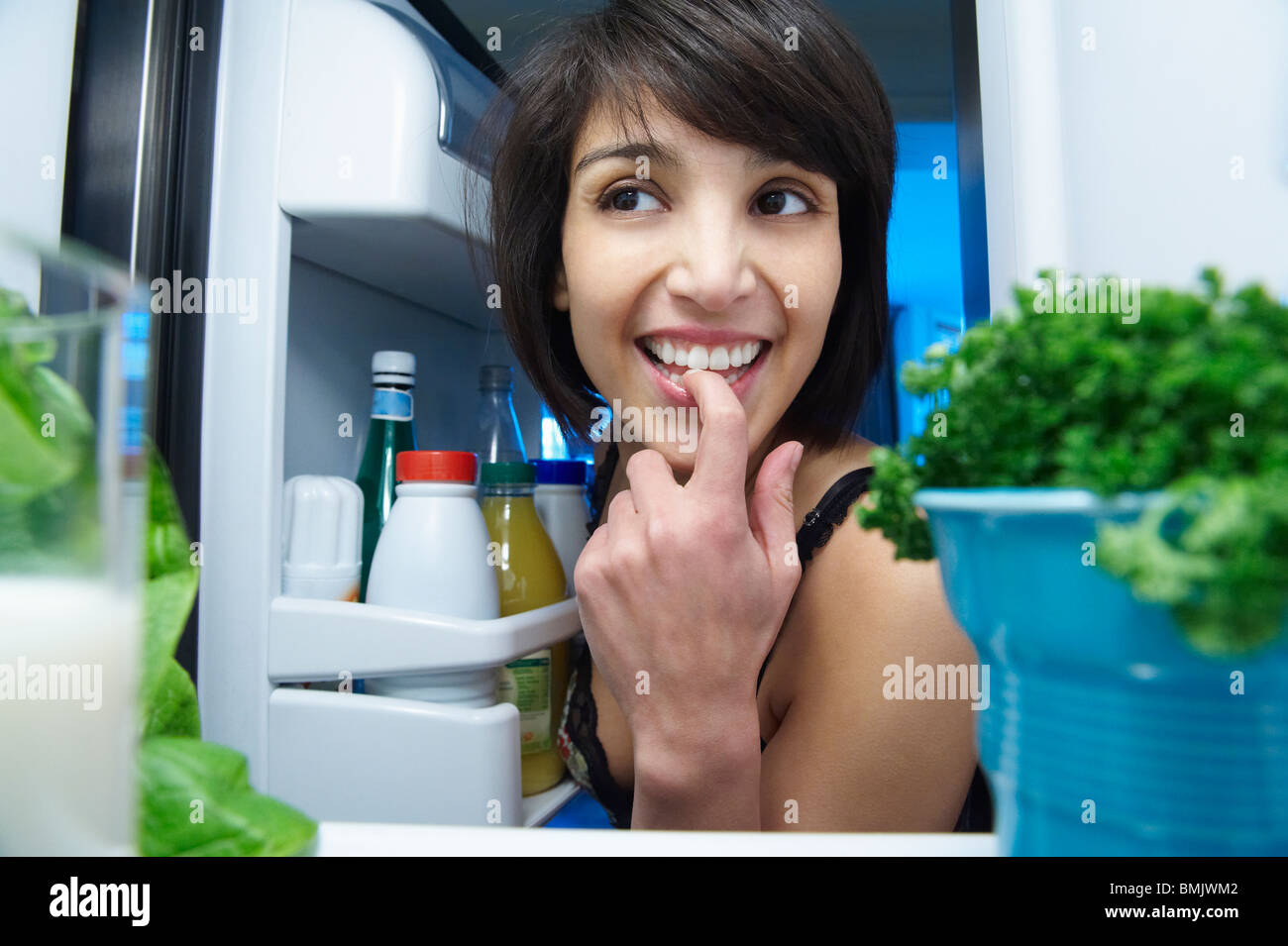 Lady looking in her fridge hi-res stock photography and images - Alamy