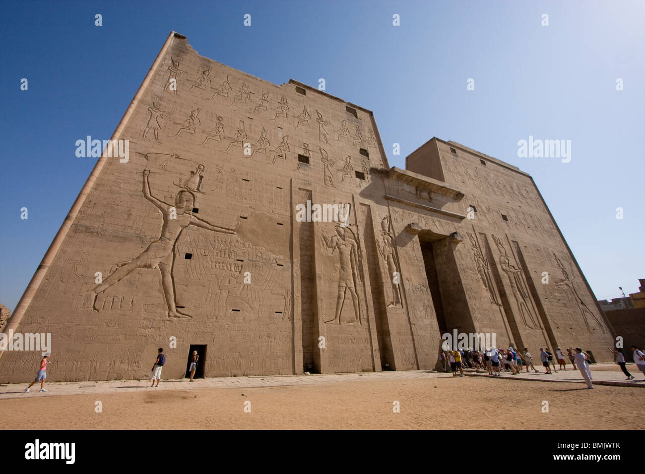 Carvings on the massive twin towers of the 36m high entrance pylon of ...