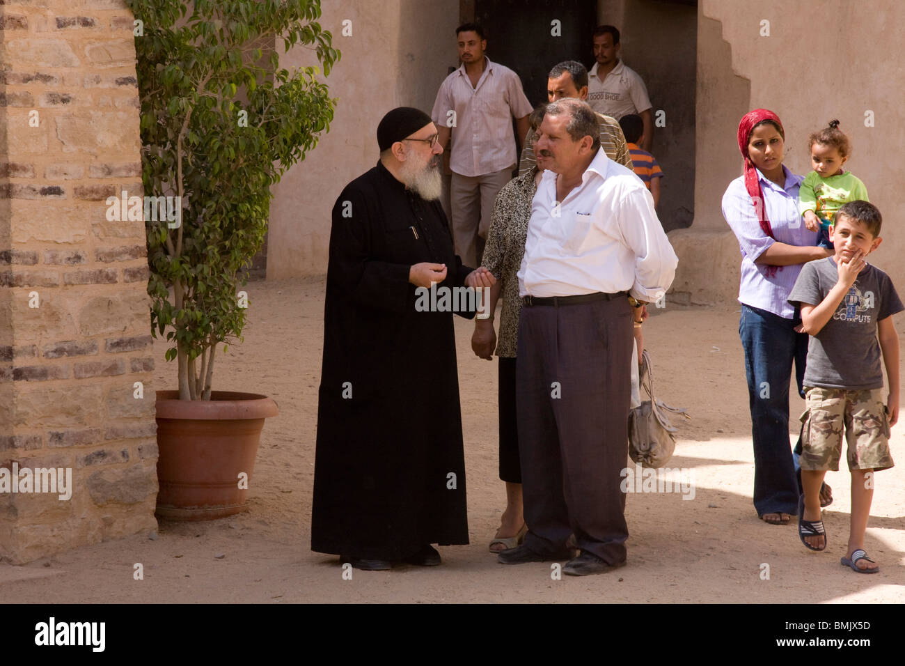 Coptic monk and family at the Monastery of the Holy Virgin and St. John ...