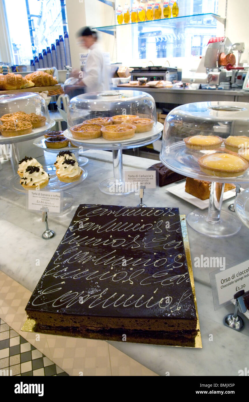 A Carluccio's cake and display of other cakes, buns and pastries for ...