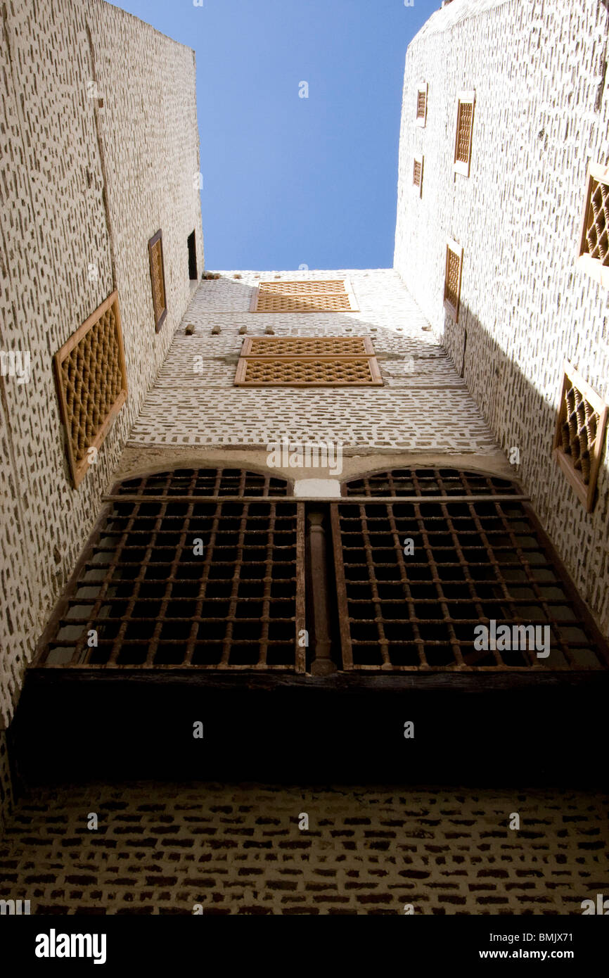Windows with wooden Mashrabeya screens overlooking the courtyard in the ...