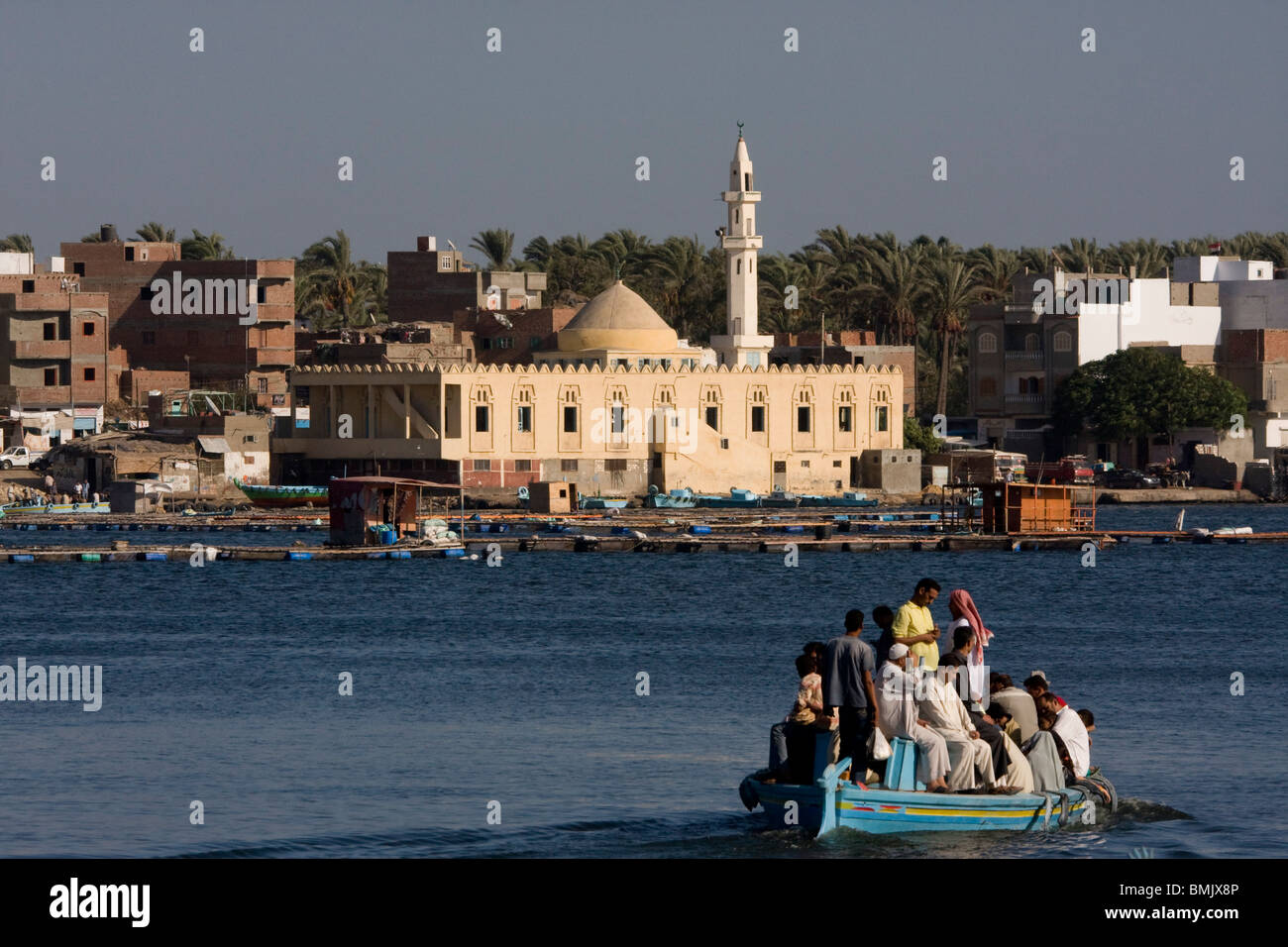 People crossing the Rosetta Branch of the Nile River in a boat ...