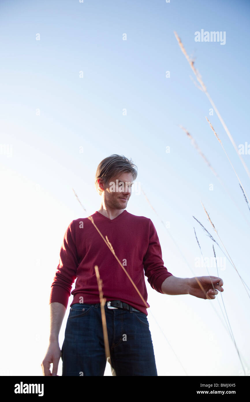 Man standing in open field Stock Photo - Alamy