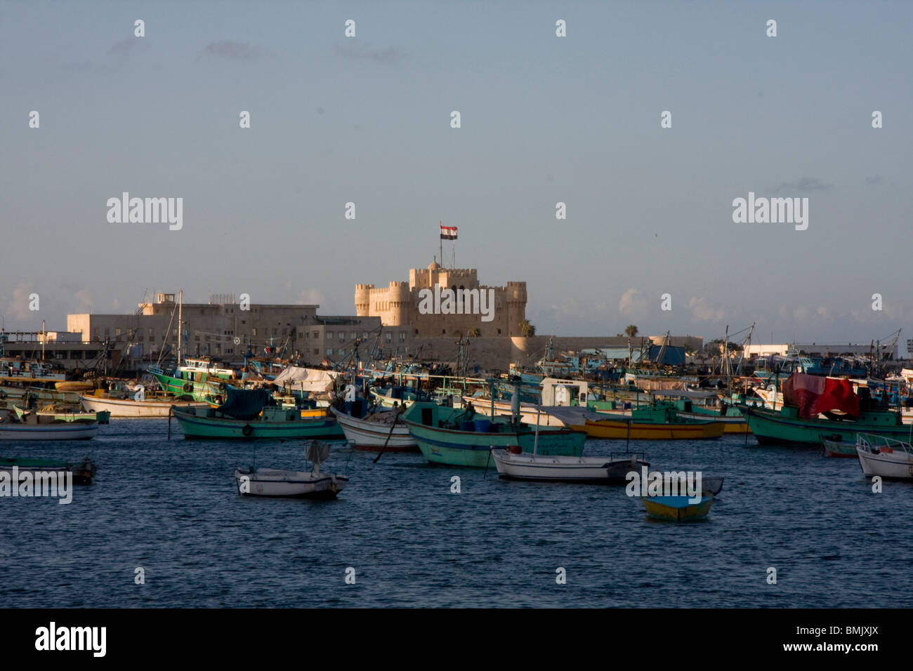 Fishing boats in the Eastern Harbour and Fort Qaitbey, Alexandria, Al ...