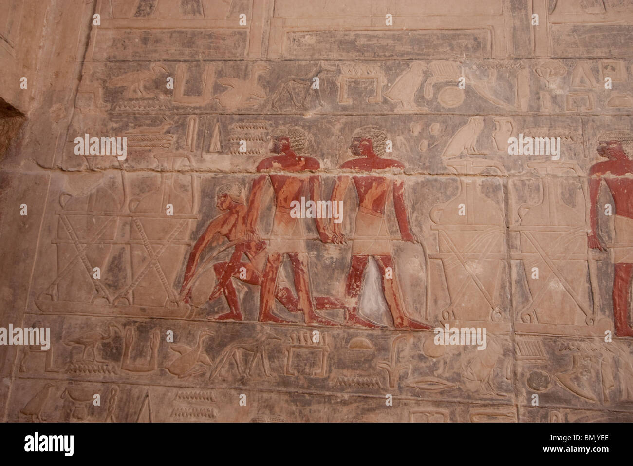 Bas-relief of a team dragging heavy loads of jars on a sledge in the ...