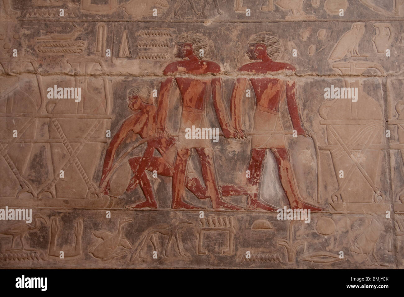 Bas-relief of a team dragging heavy loads of jars on a sledge in the ...