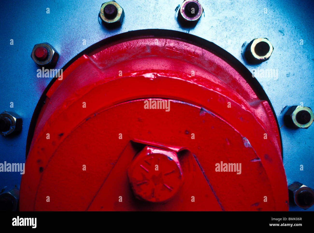 Close up of nuts and bolts of large industrial machine wheel Stock ...
