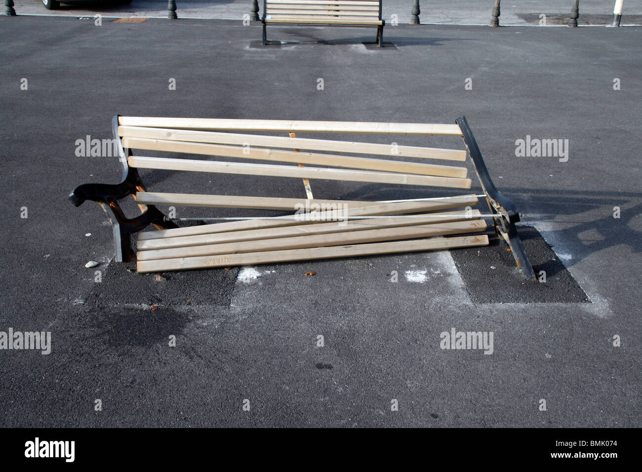 damaged park bench in city town Stock Photo - Alamy