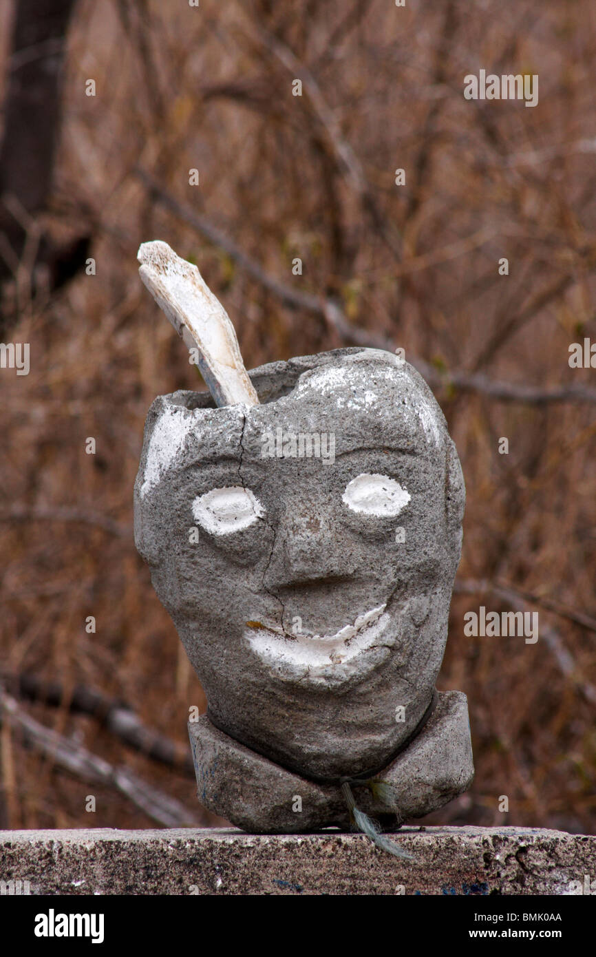 face carving pot at Post Office Bay, Floreana Island, Galapagos Islands ...