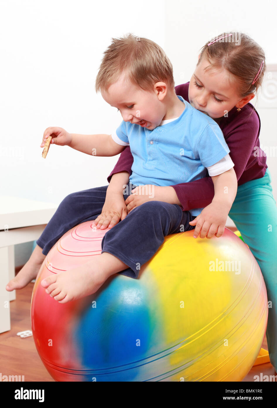 Kids have a fun with the gymnastic ball Stock Photo - Alamy