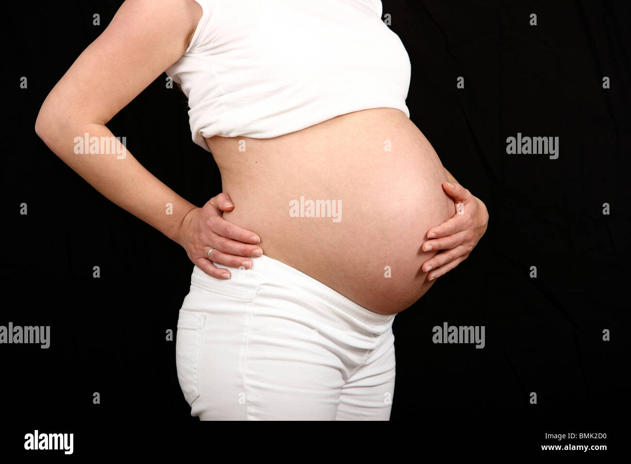 Pregnant, young woman, 9th month Stock Photo - Alamy