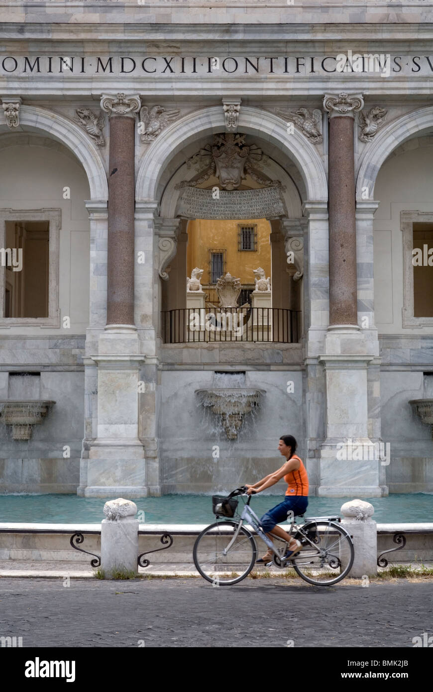 A biker passes by La Fontana Paola in Monte Gianicolo, Rome, Italy ...