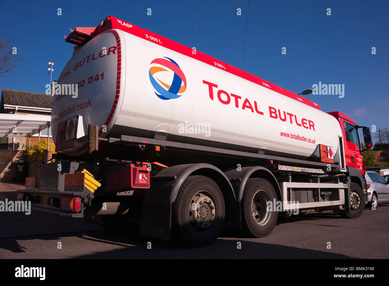 A Total Butler lorry delivering heating oil to a domestic property in ...