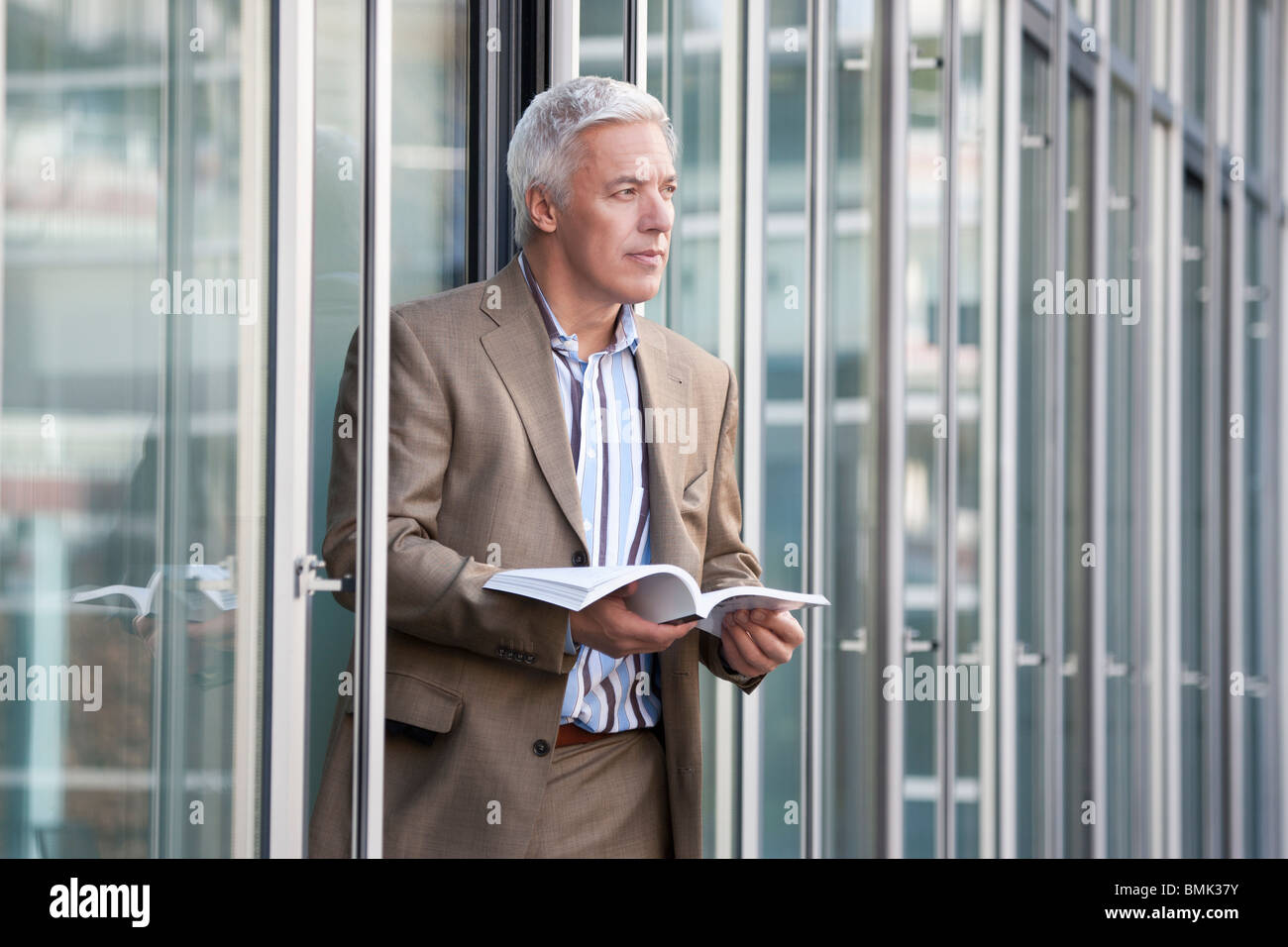 Reading outside the office Stock Photo - Alamy