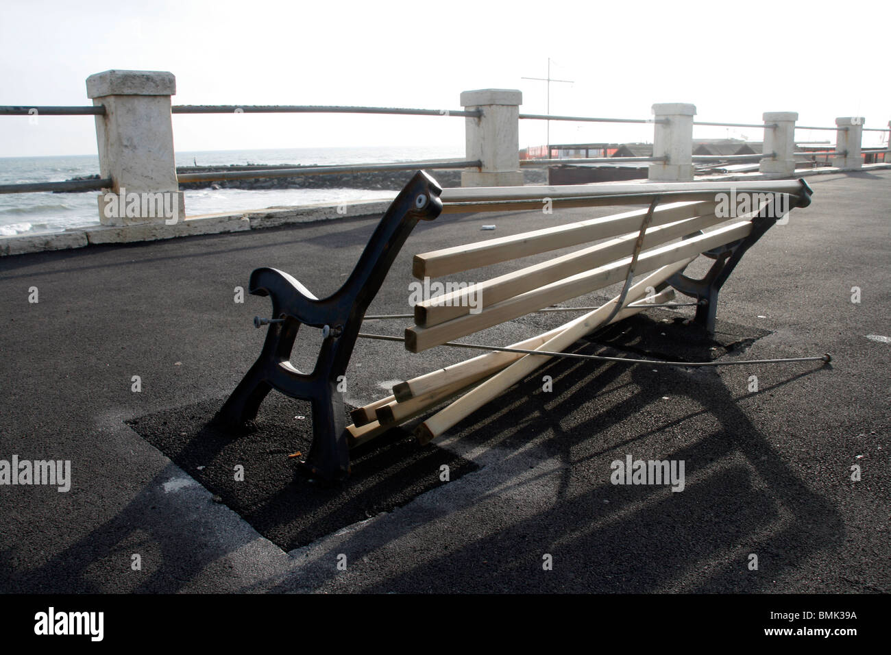 damaged park bench in city town Stock Photo - Alamy