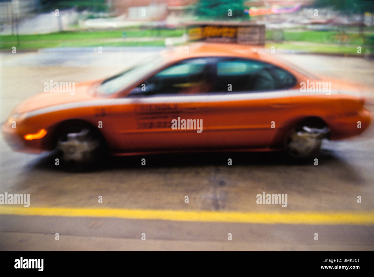 Moving taxi cab Stock Photo - Alamy