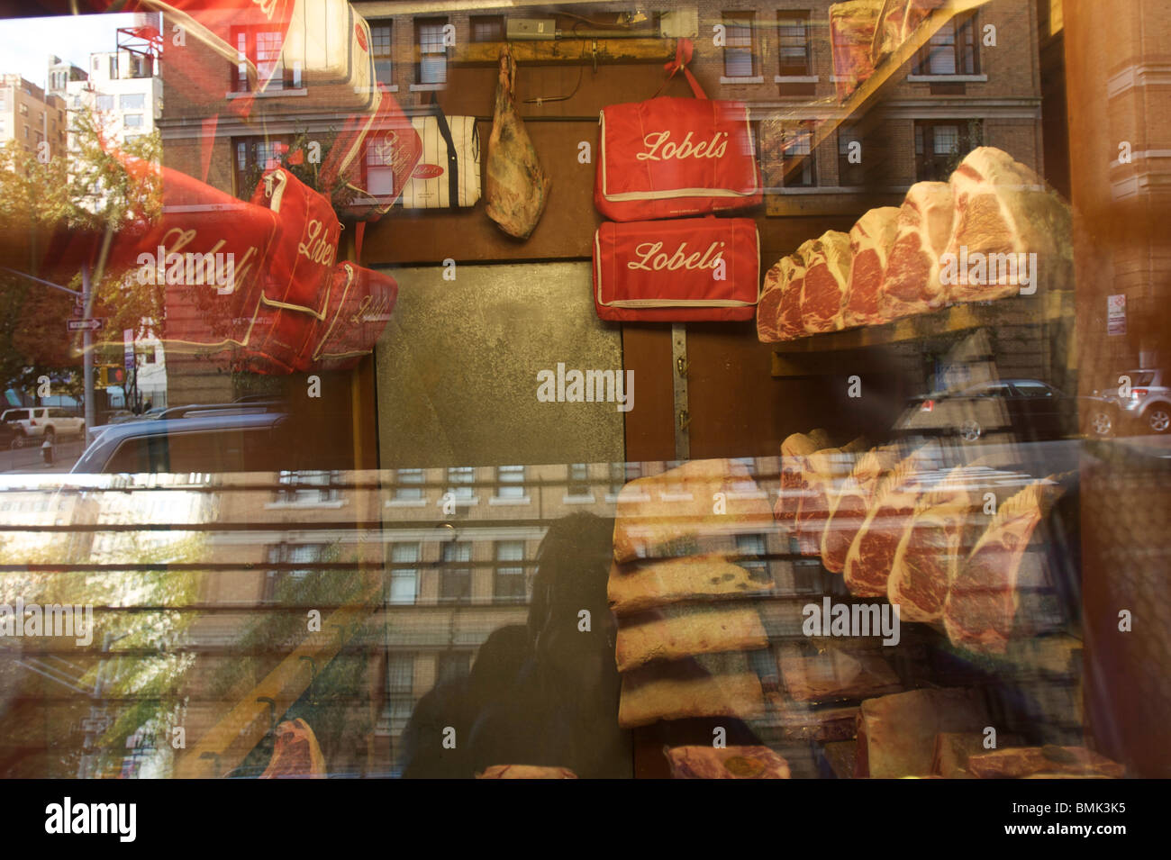 New York, a butchers windows with photographers reflection Stock Photo ...