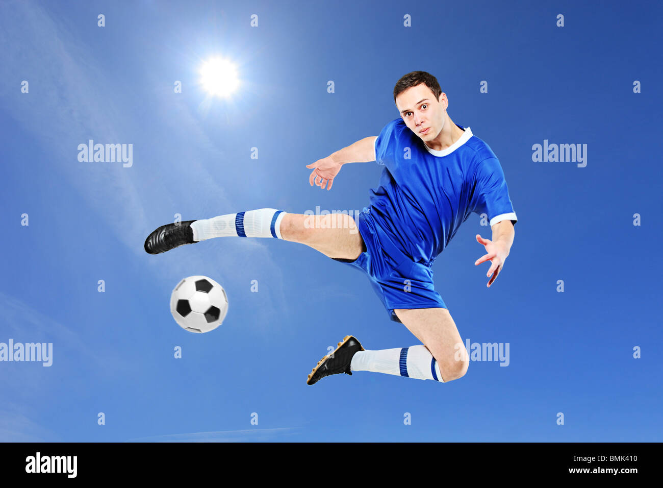 Soccer player with a ball in action Stock Photo - Alamy