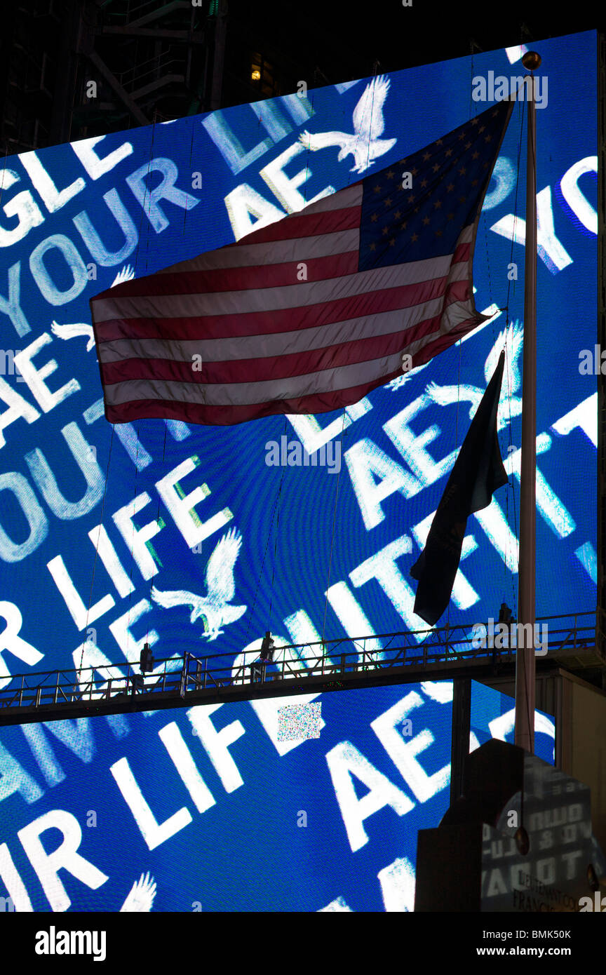 An American Flag flies in Times Square New York Stock Photo - Alamy