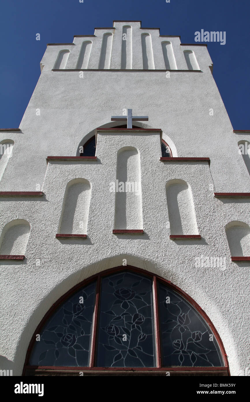 The steeple of a white stucco church against a blue sky Stock Photo - Alamy