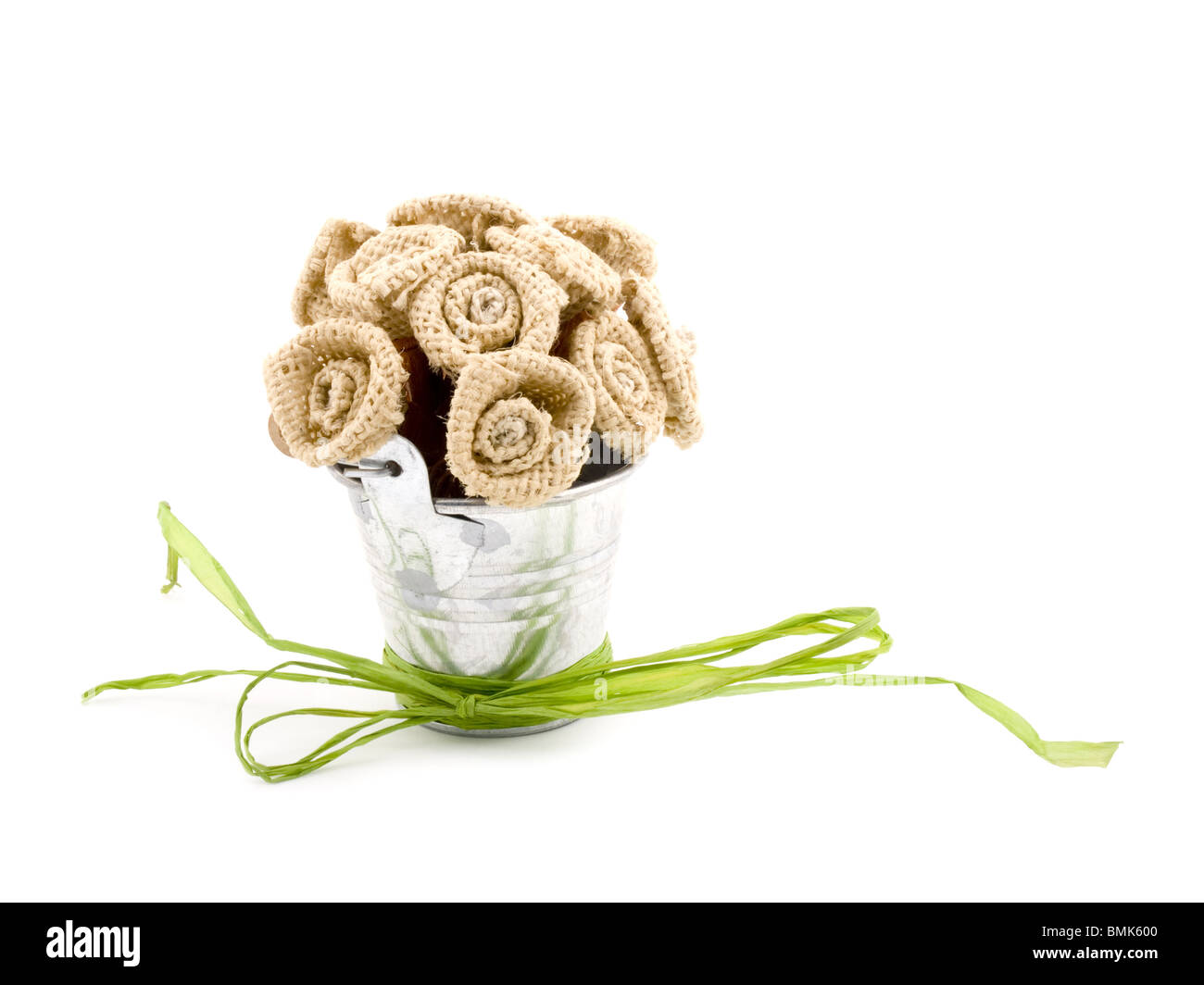 Handmade flowers in small bucket on white background Stock Photo - Alamy