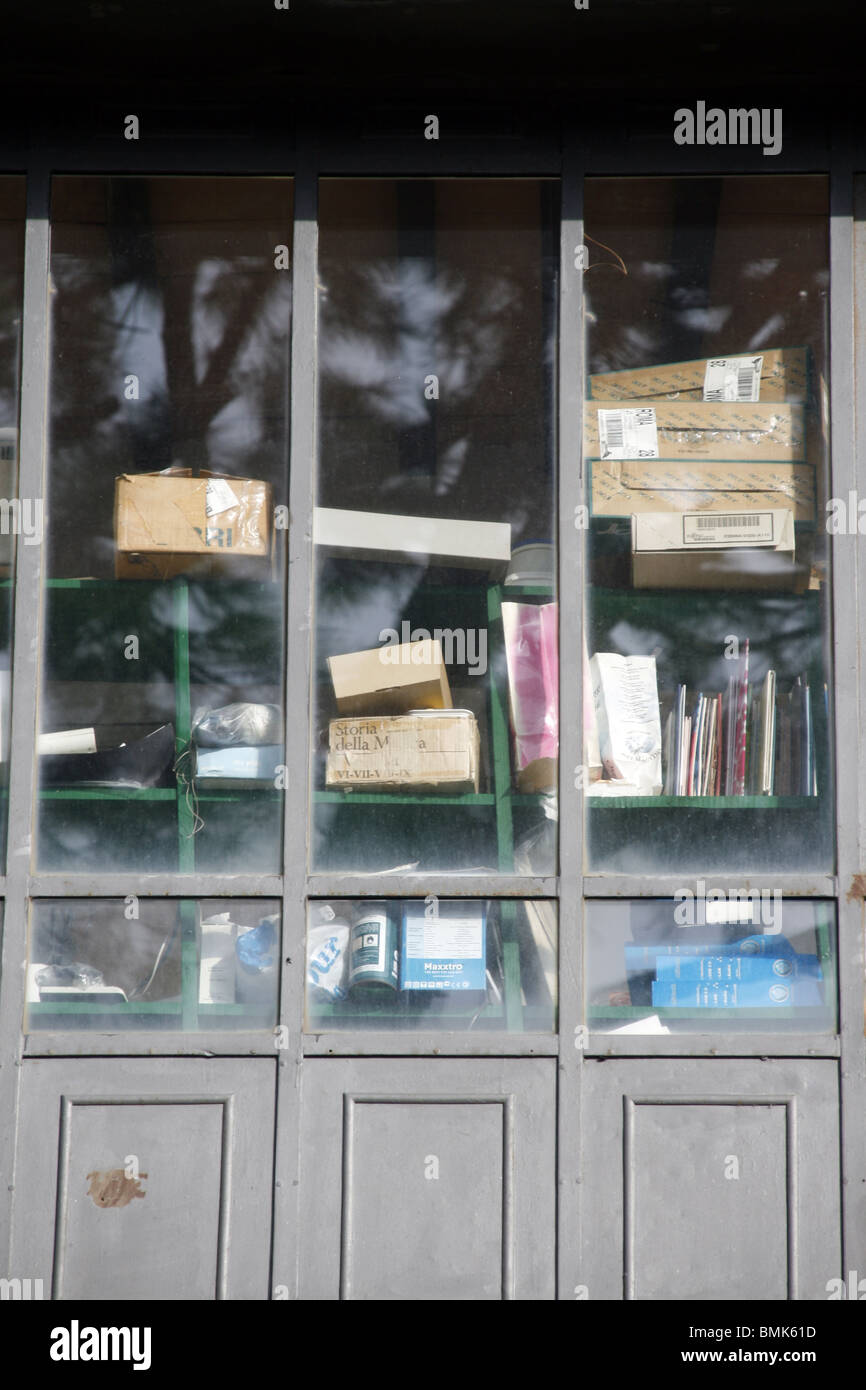 boxes and files on shelves in office window Stock Photo - Alamy