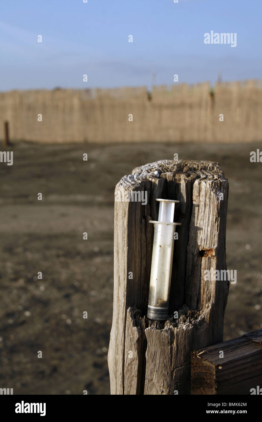 syringe left on beach by drug addict Stock Photo - Alamy