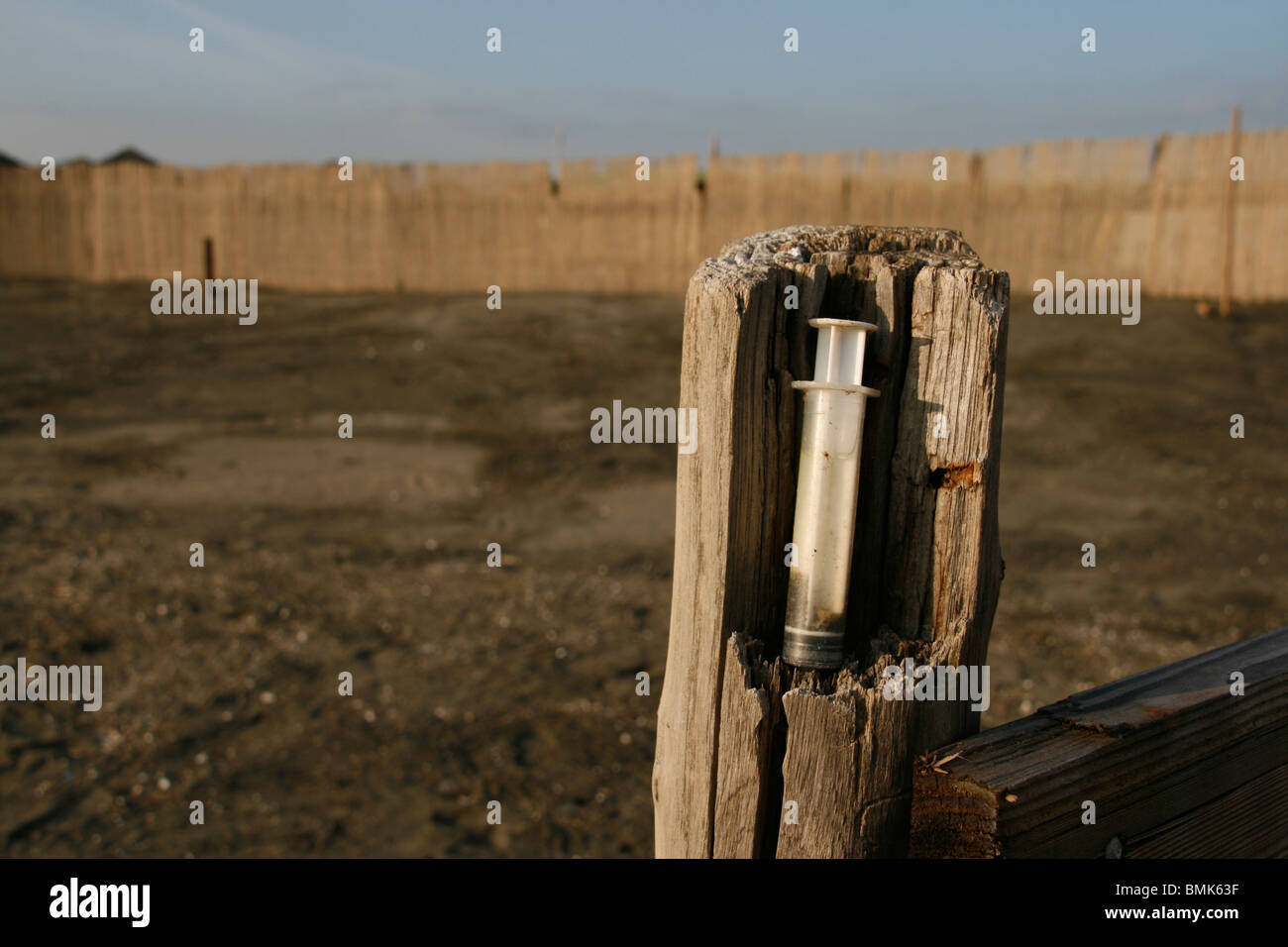 syringe left on beach by drug addict Stock Photo - Alamy