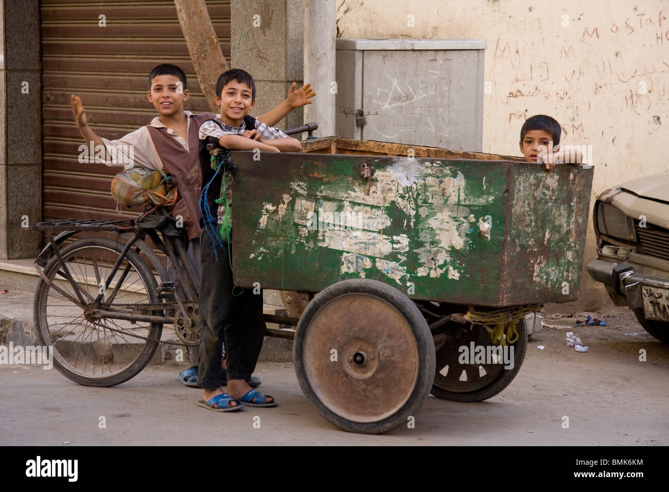 Boys by a tricycle, Cairo, Al Qahirah, Egypt Stock Photo - Alamy