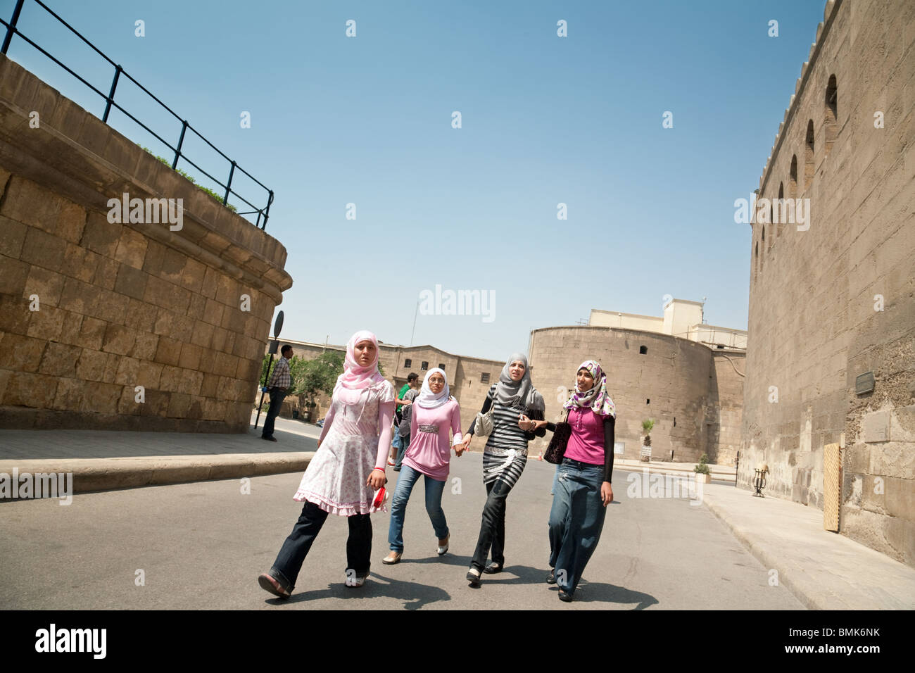 Four egyptian girls walking along the street, the Islamic Quarter ...