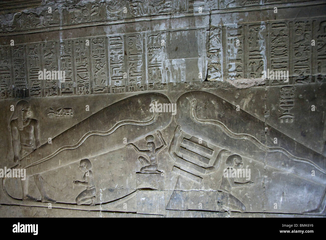 Bas-relief of a snake that comes out of the lotus temple of Hathor ...