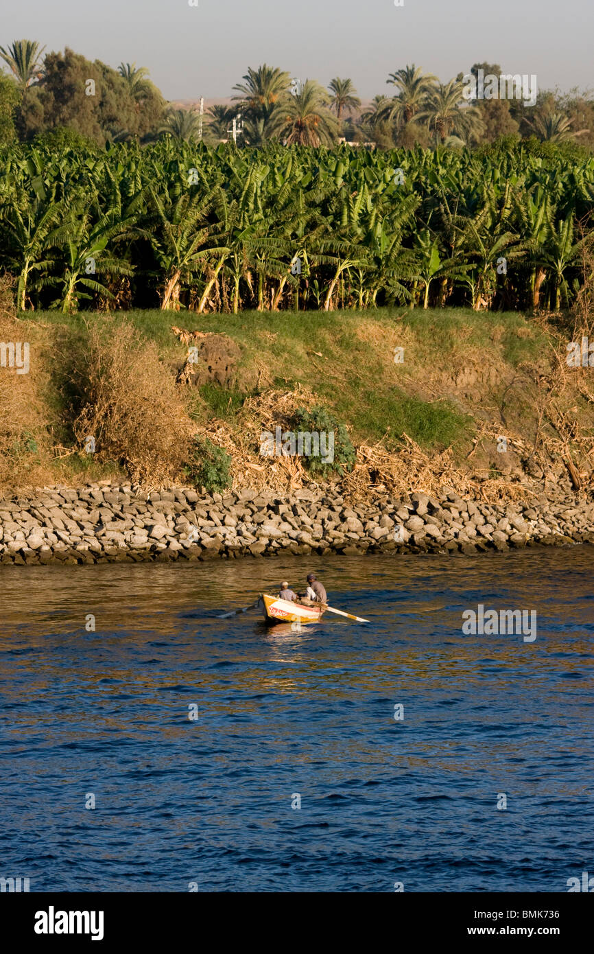 Men rowing a boat on the Nile River between Luxor and Esna, Qina, Egypt ...