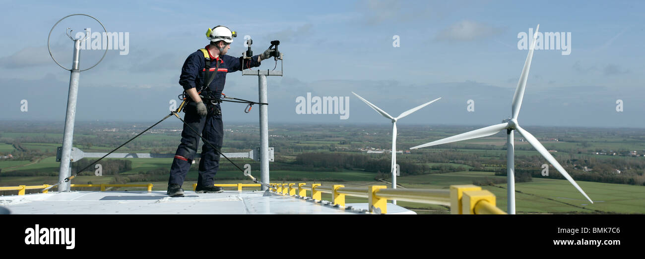 Environment : maintenance at the top of a windmill Stock Photo - Alamy