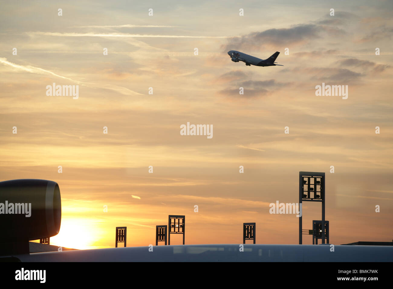 Airplane at sunset Stock Photo - Alamy