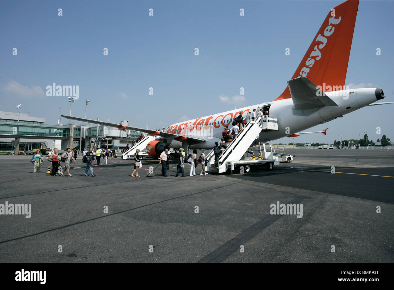 Passengers boarding an airplane Stock Photo - Alamy