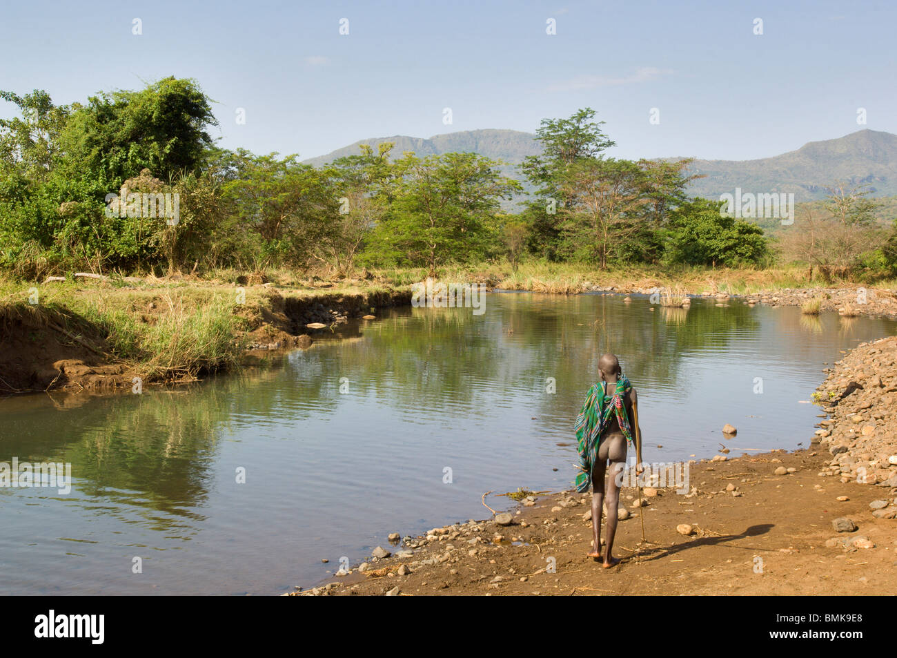 Africa, Ethiopia, Omo region, Kibish. Suri boy crosses river Stock ...