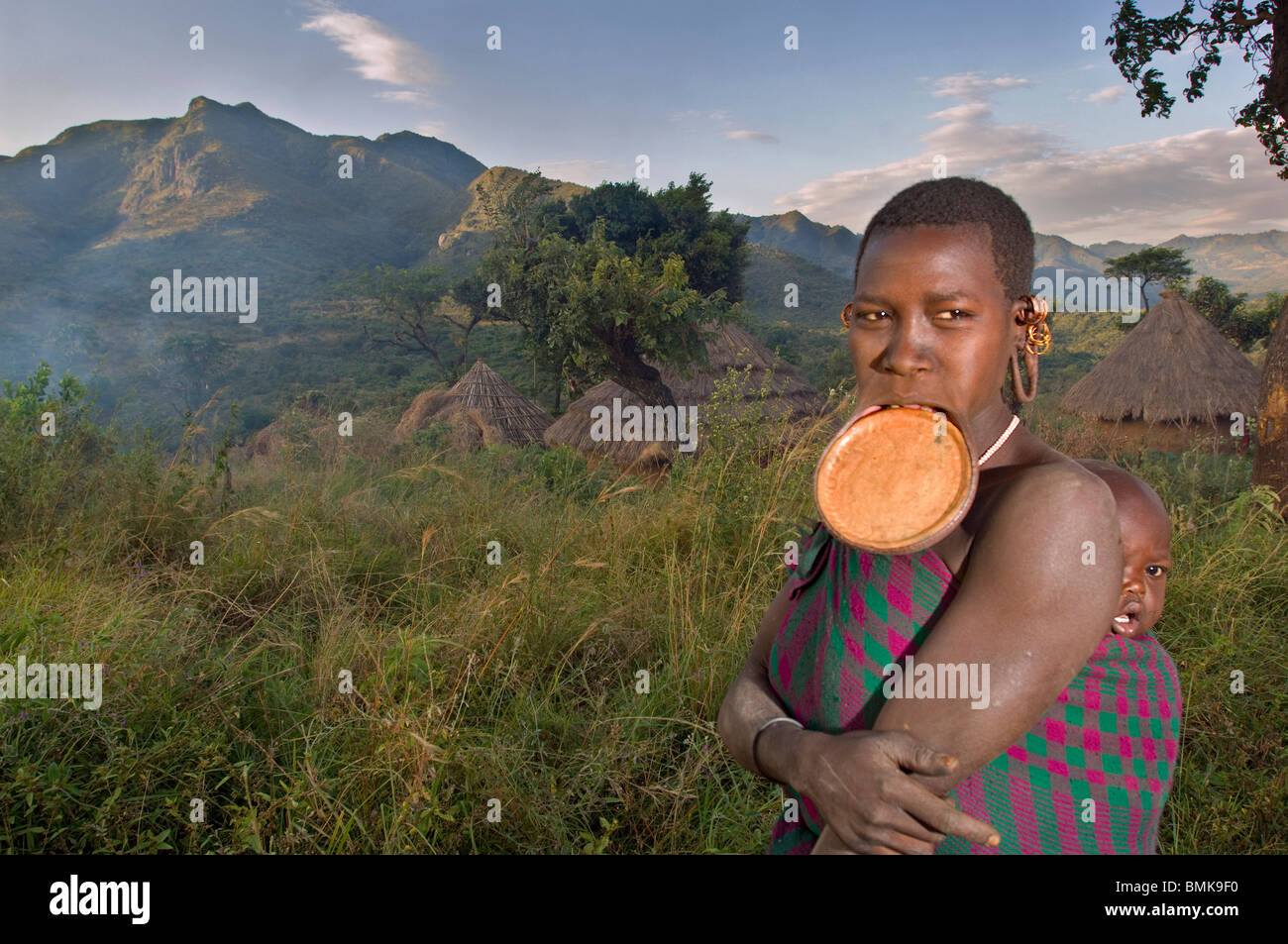 Africa, Ethiopia, Omo region, Kibish. Suri-tribe woman with her child ...