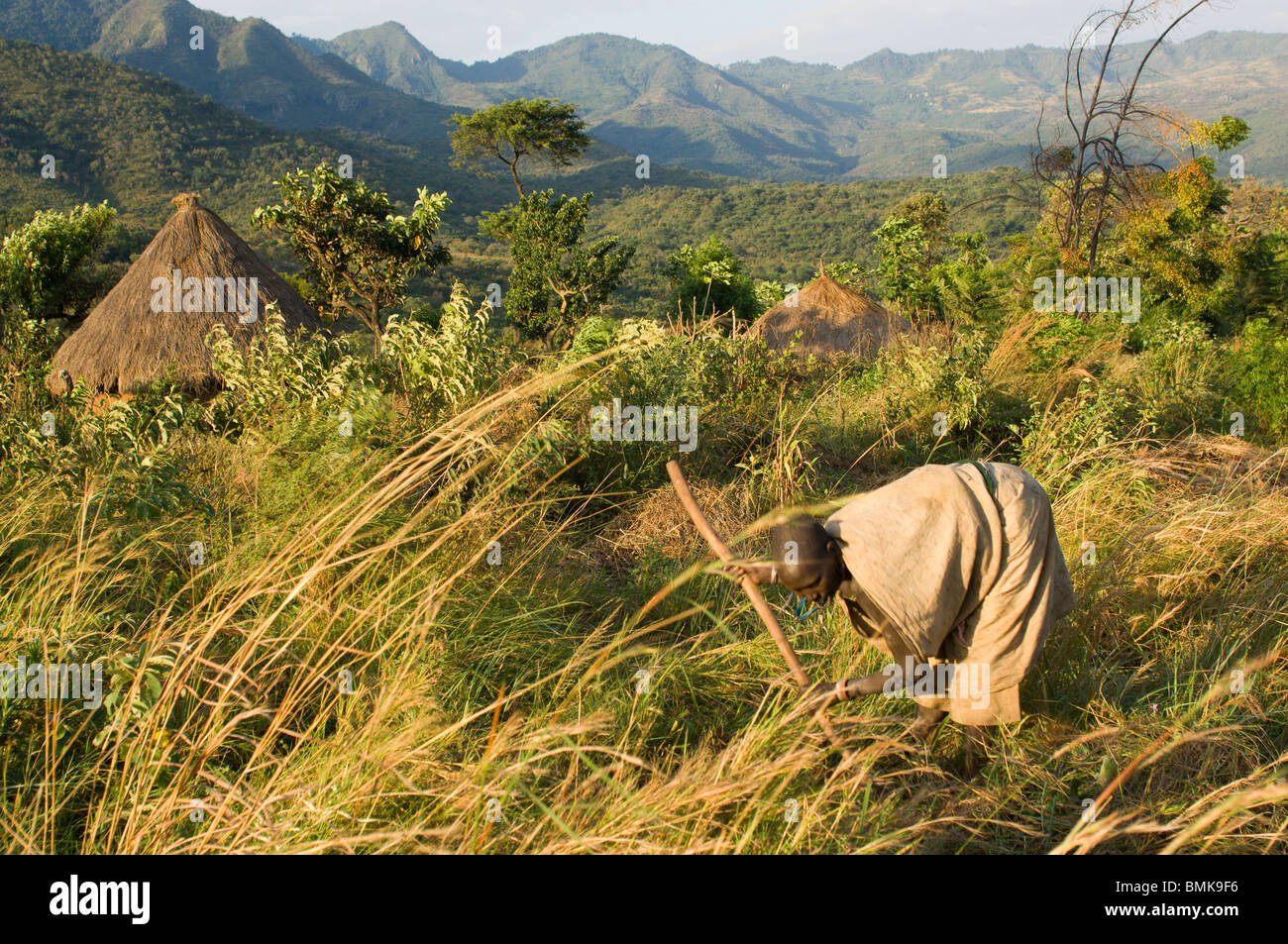 Africa, Ethiopia, Omo region, Kibish. Suri-tribe woman working outside ...