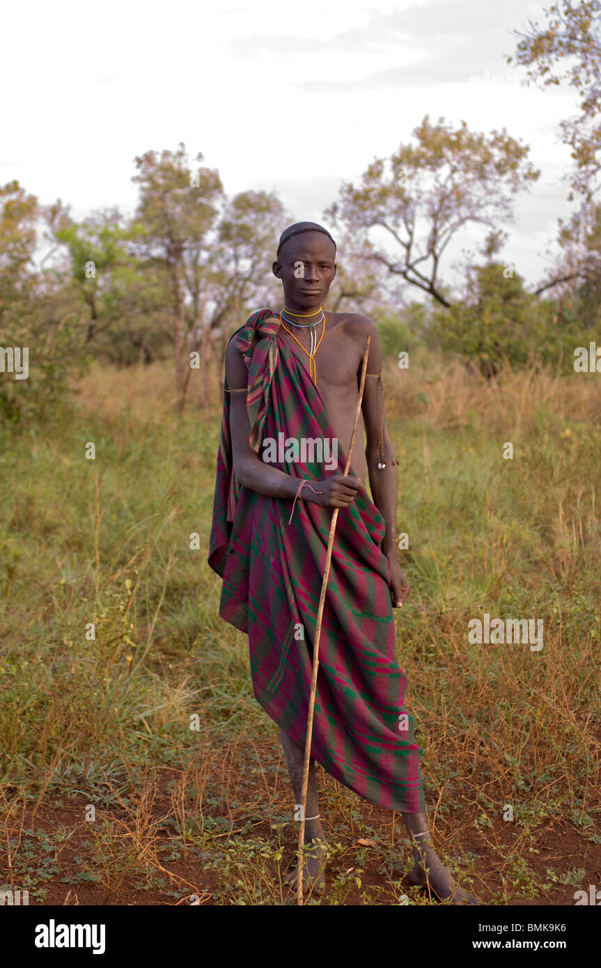 Ethiopia, Omo Region, Tulgit. Lone Suri man standing in the bush Stock ...