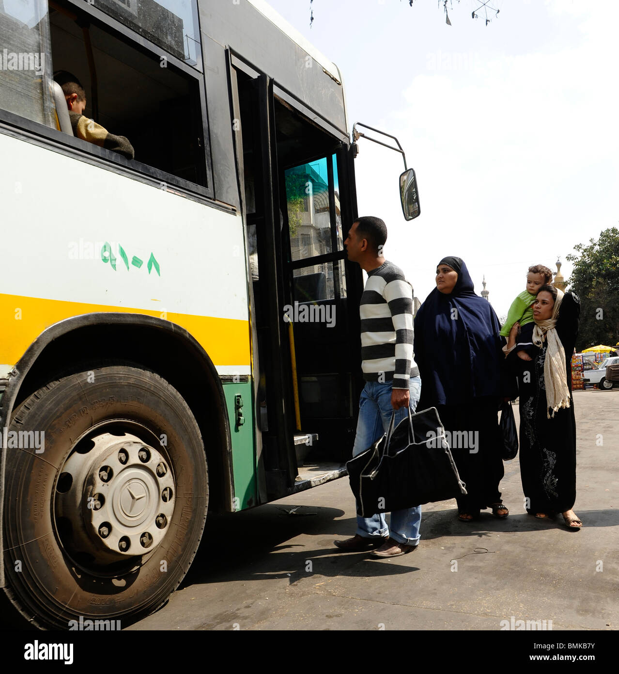 people boarding bus , souk goma (friday market), street market ...