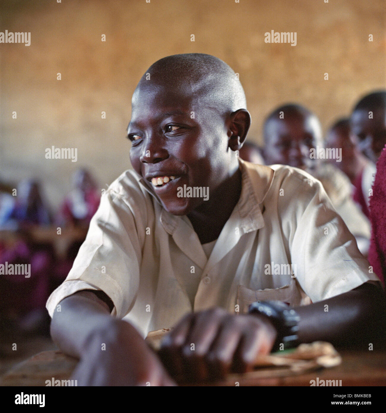 Young Kenyan boys wearing ragged school uniform in traditional village ...