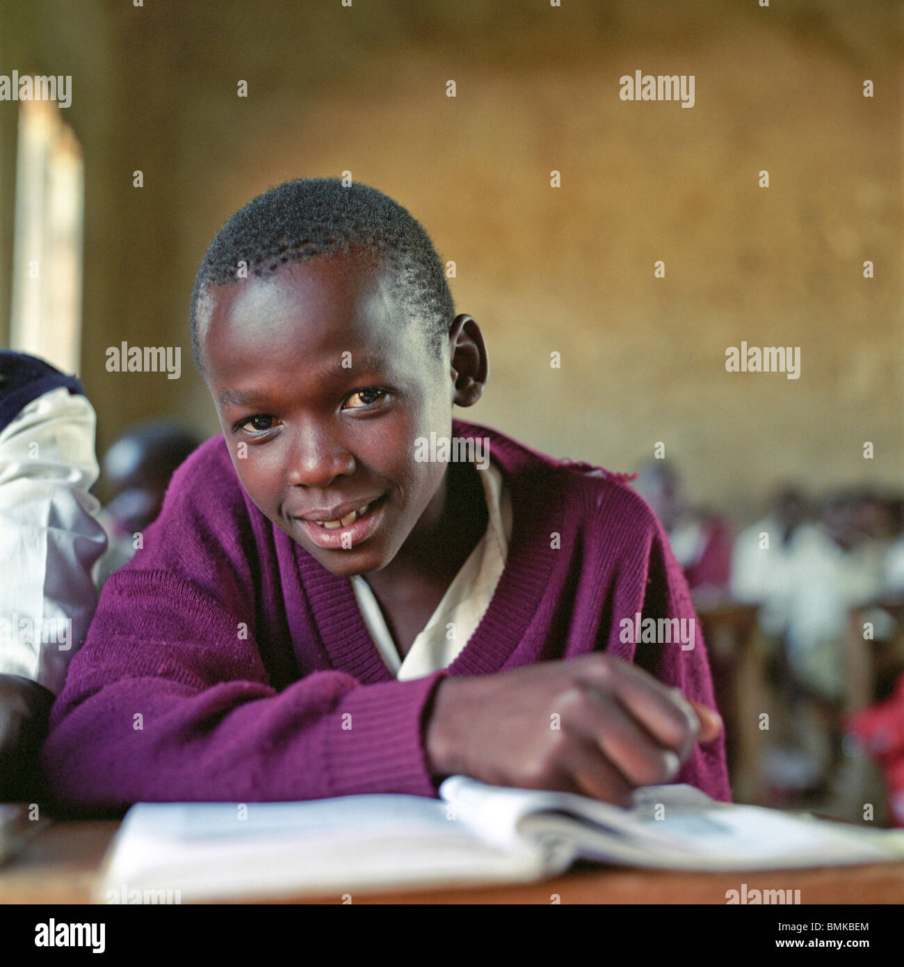 Young Kenyan boys wearing ragged school uniform in traditional village ...
