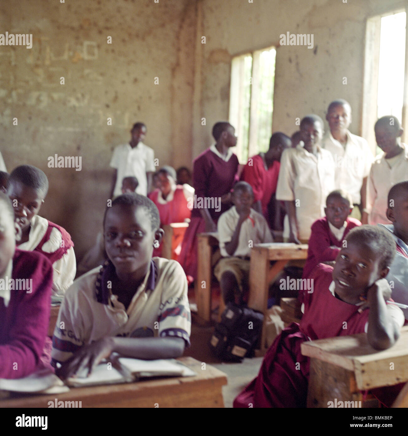 Young Kenyan boys and girls wearing ragged school uniform in ...