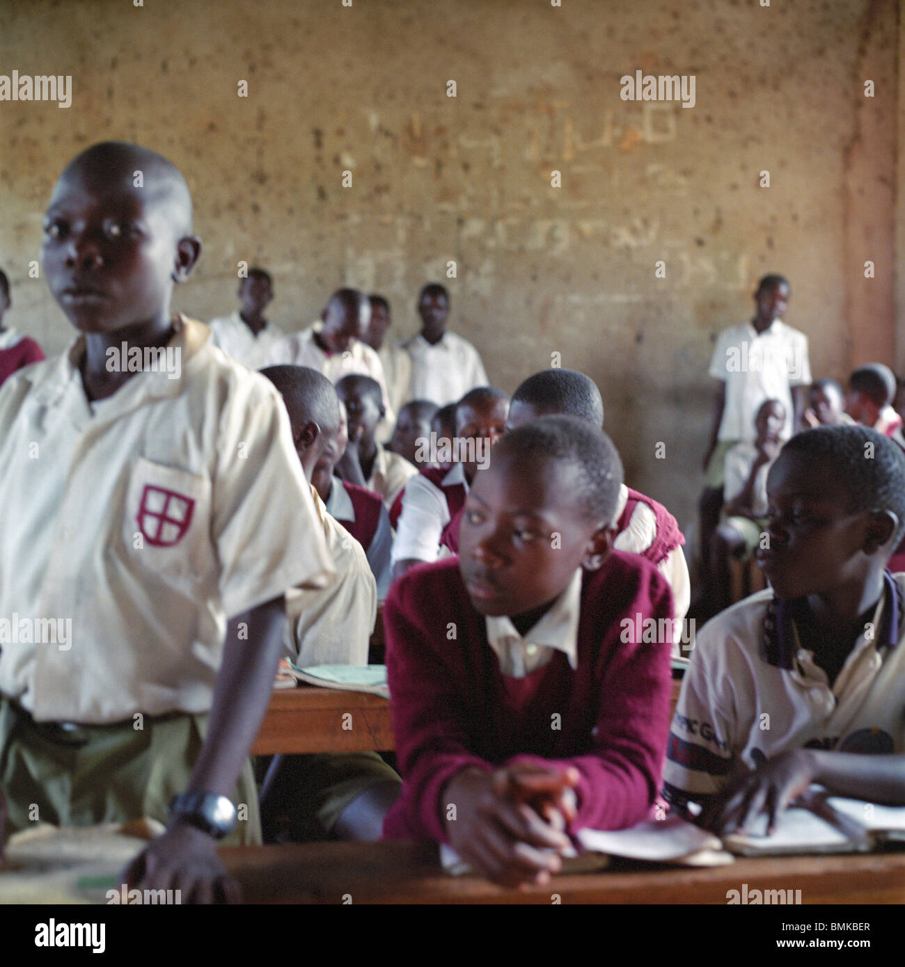 Young Kenyan boys and girls wearing ragged school uniform in ...