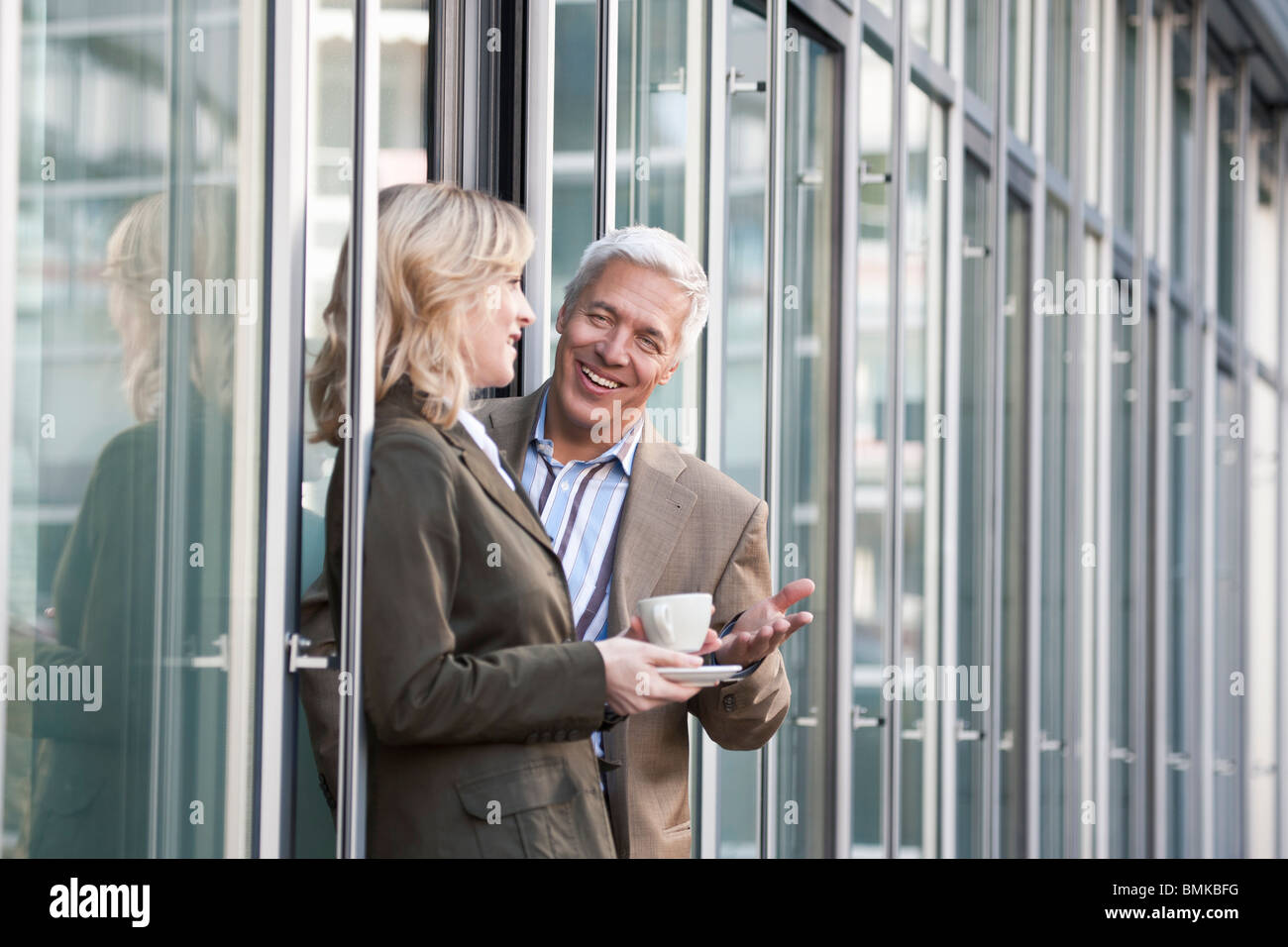 Having a coffee break outside the office Stock Photo - Alamy
