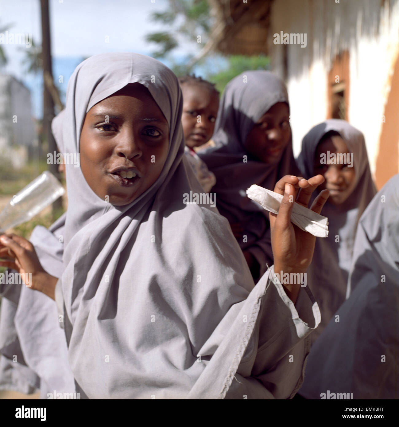 Girls in kenya africa wearing traditional muslim head scarf and outfits ...